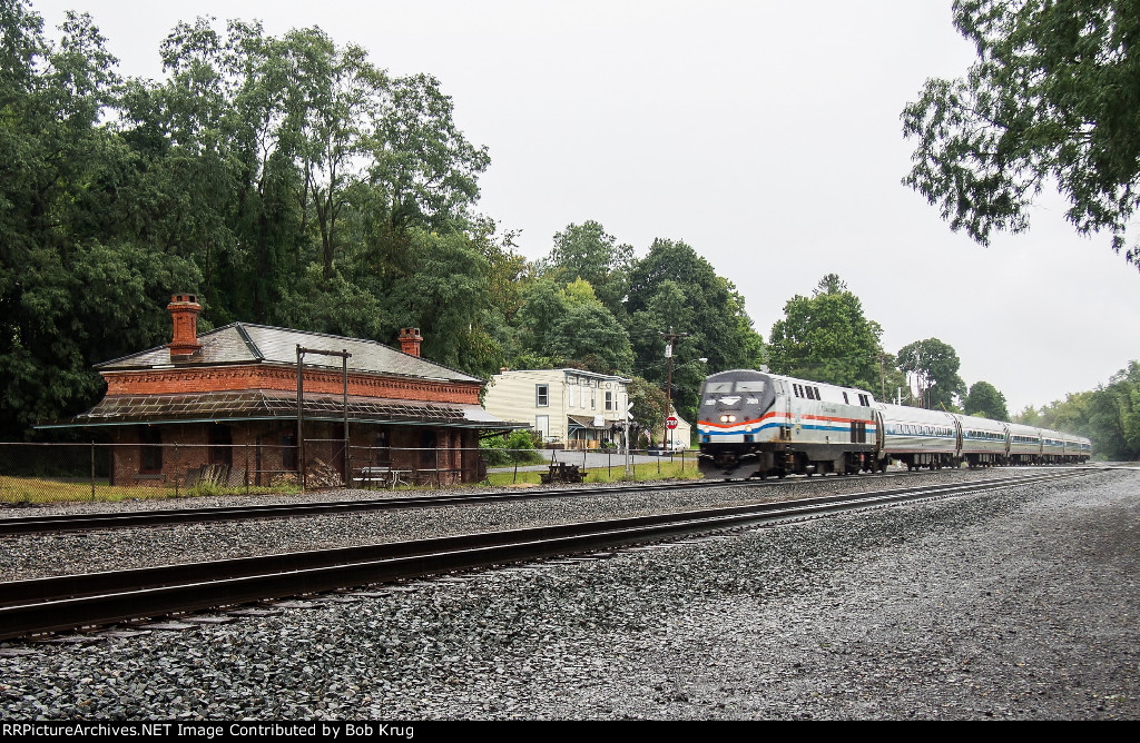 AMTK 701 heads the northbound Adirondack as it speeds past the old NYC depot at Stuyvesant Landing